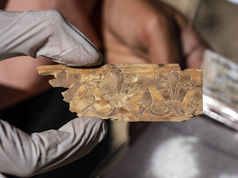 Ivory plaque decorated with a lotus flower.