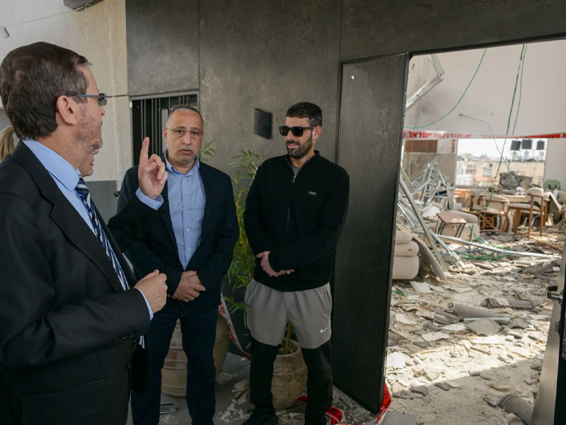 President Herzog at the missile impact site in Kfar Qasem