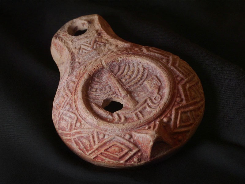 The rare 1,700-year-old oil lamp, decorated with Temple symbols.